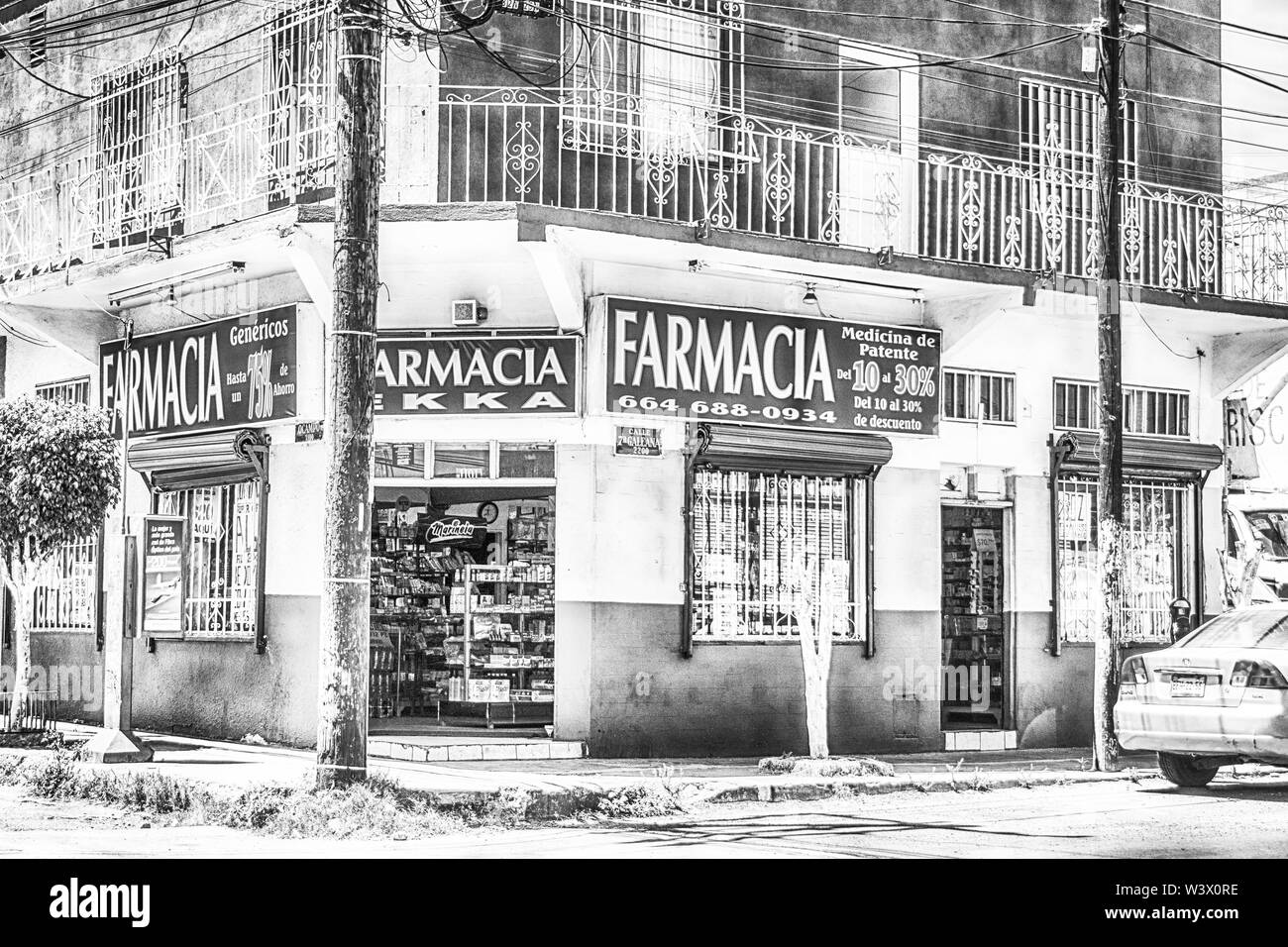 A corner pharmacy in Tijuana, Mexico in black and white Stock Photo - Alamy