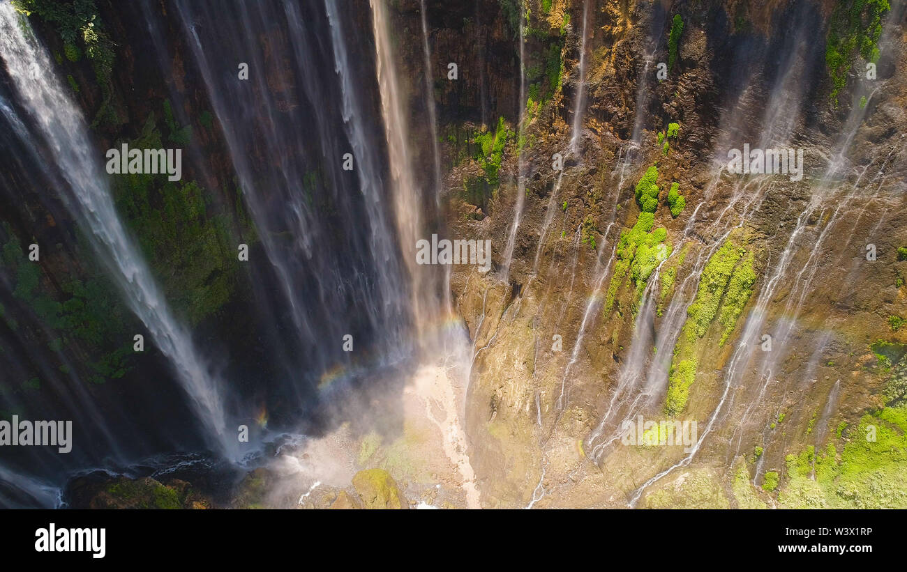 beautiful waterfall Coban Sewu in tropical forest, Java Indonesia ...