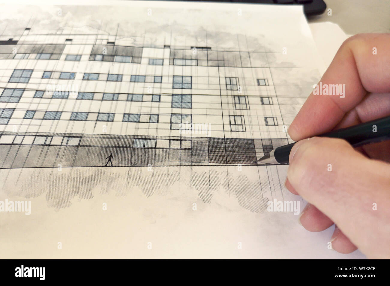Architect working on blueprint. Architectural drawings and sketches ...