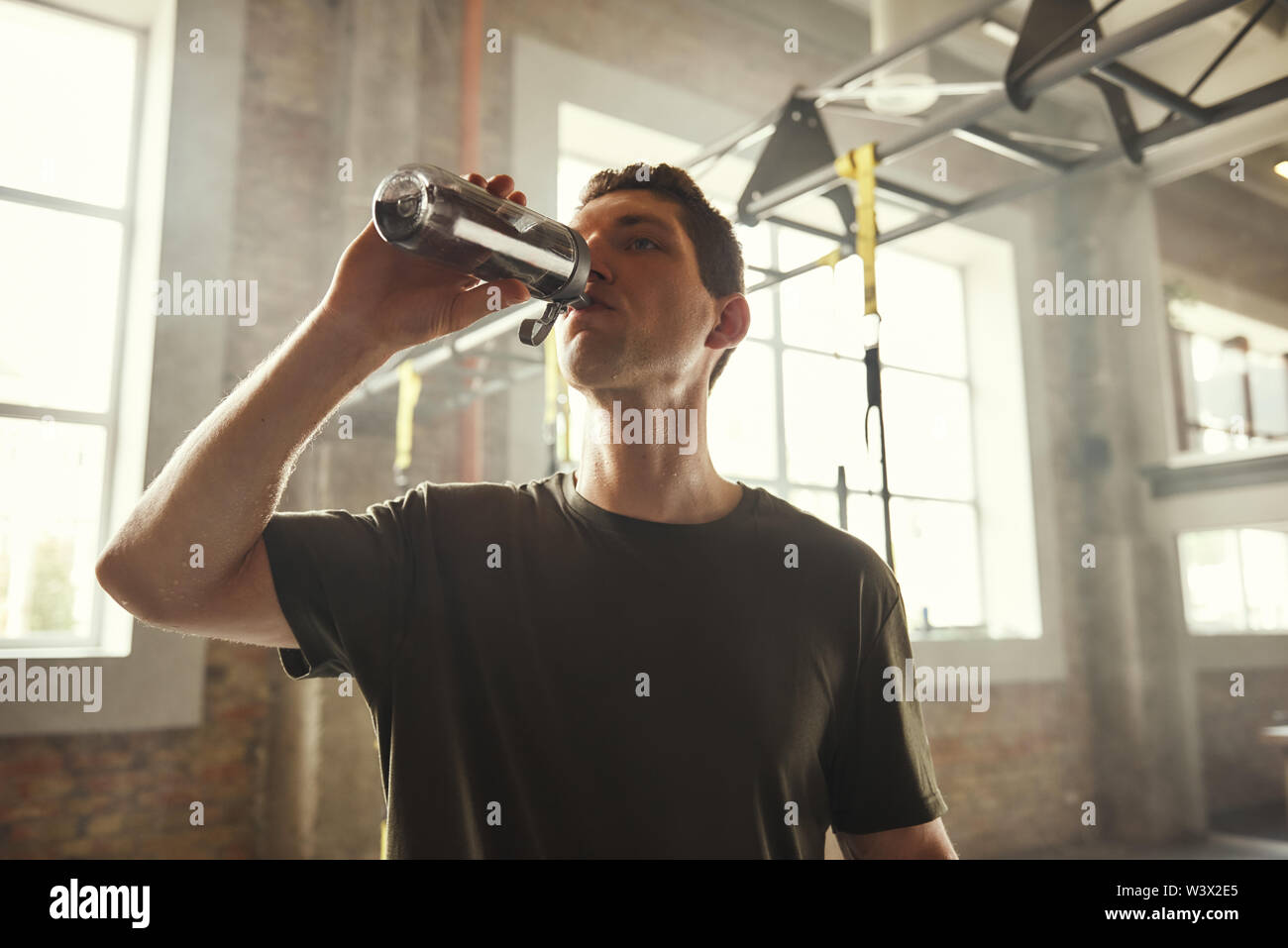Muscular men drinking water from hi-res stock photography and images ...