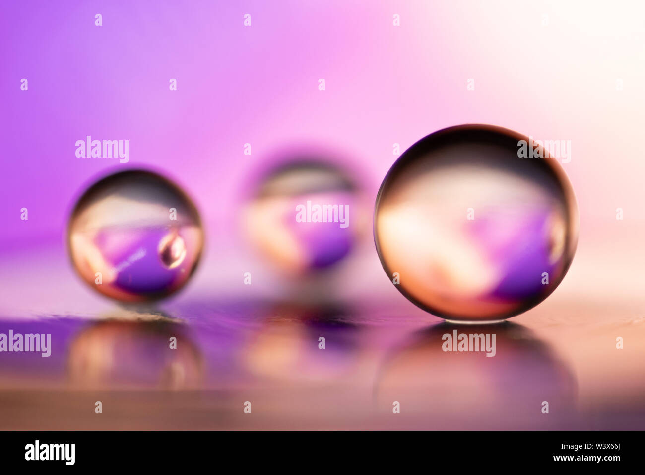 Small glass ball in abstract macro composition Stock Photo - Alamy