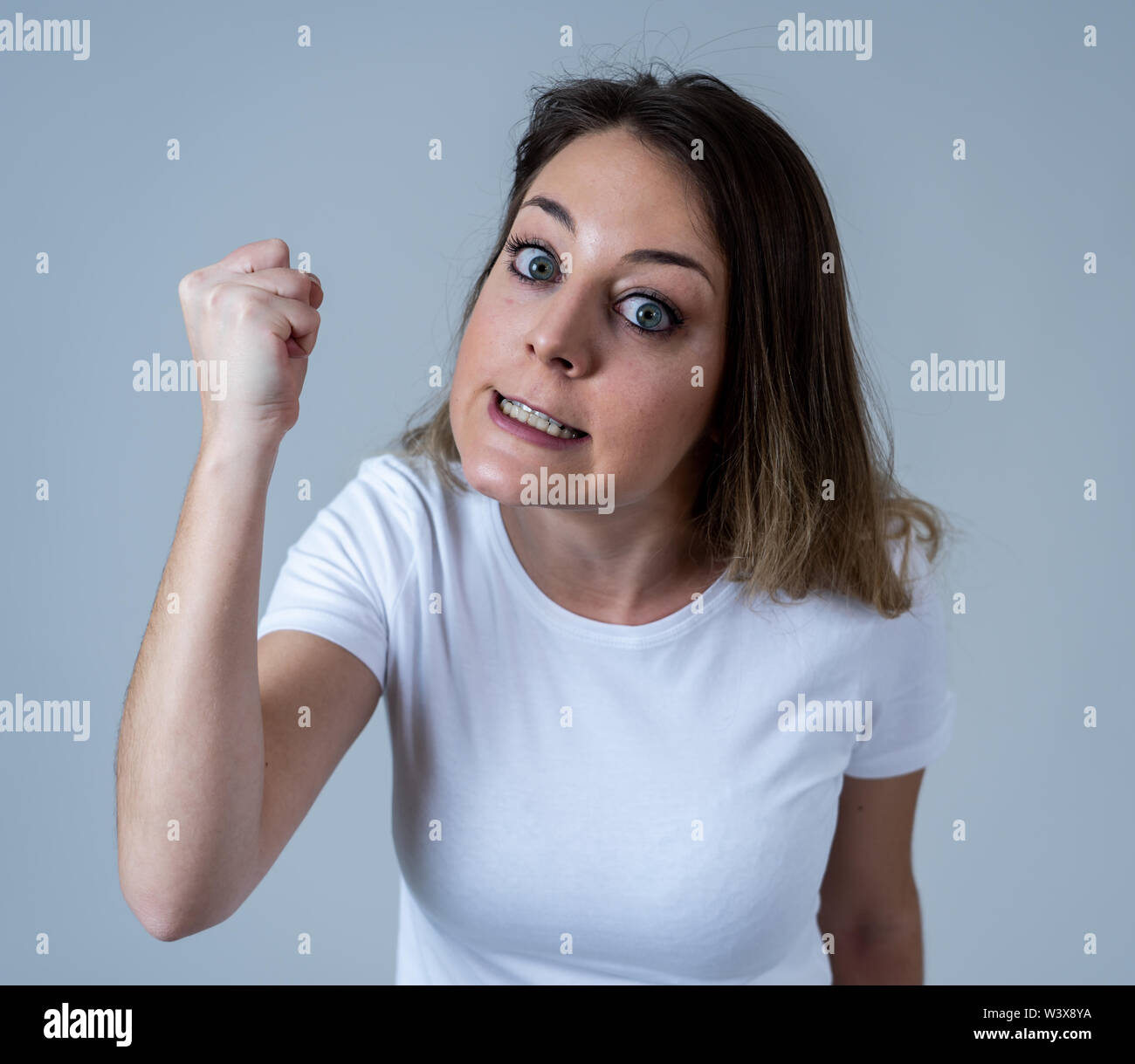 Close up portrait of young attractive caucasian woman with an angry ...