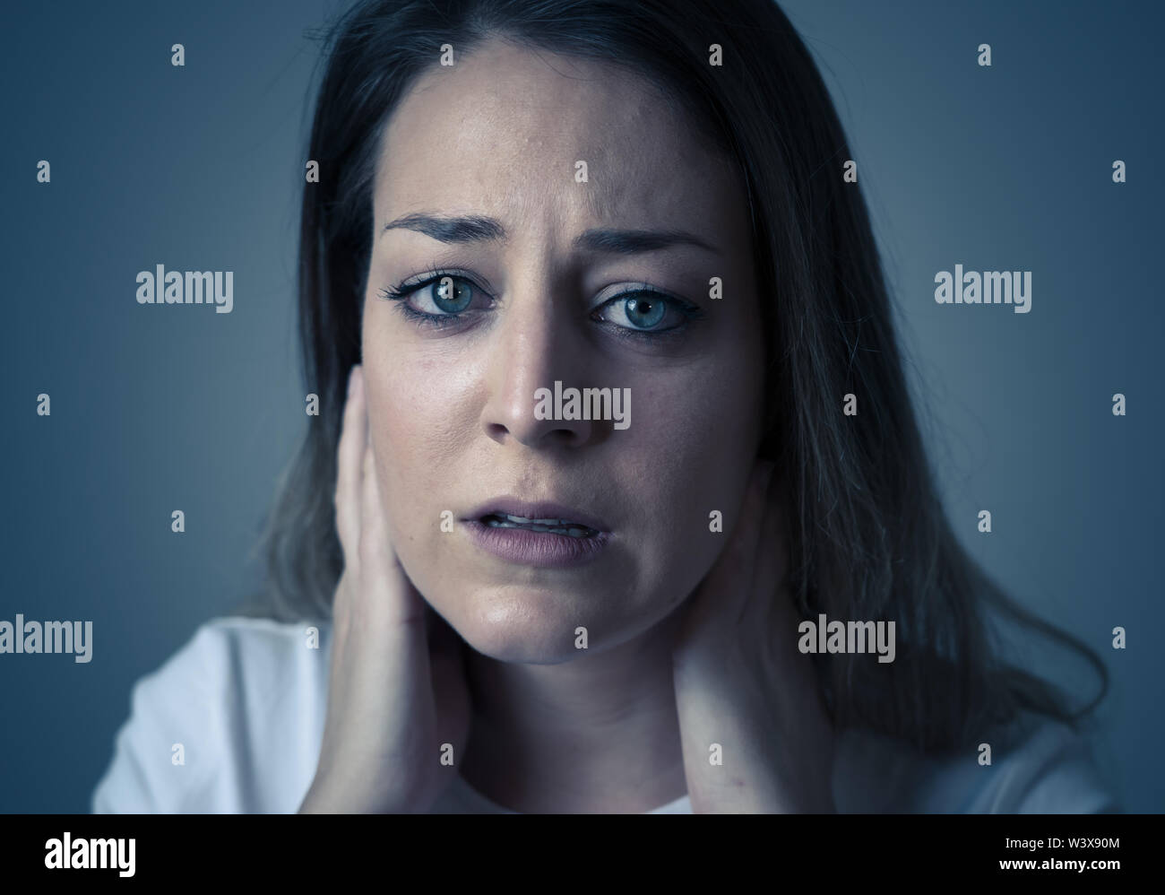 Close up portrait of beautiful young woman with sad mood looking ...