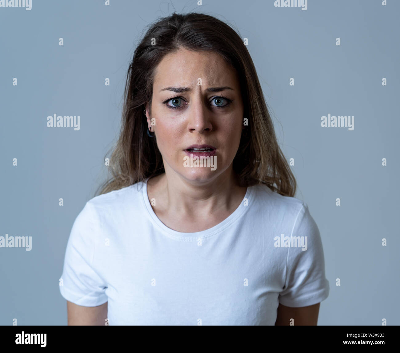 Close up of young woman feeling scared and shocked making fear, anxiety ...