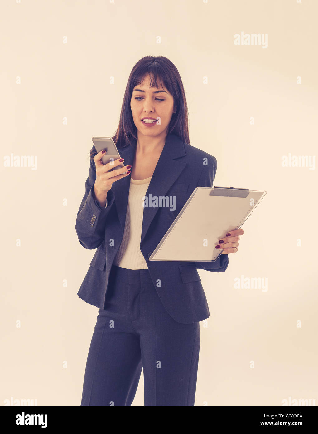 Close up of a young beautiful business woman standing speaking on the ...