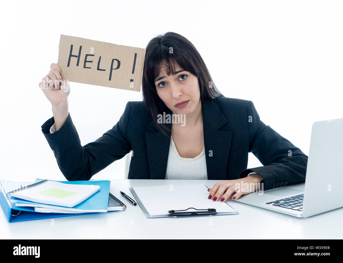 Young beautiful business woman suffering stress working at desk holding ...