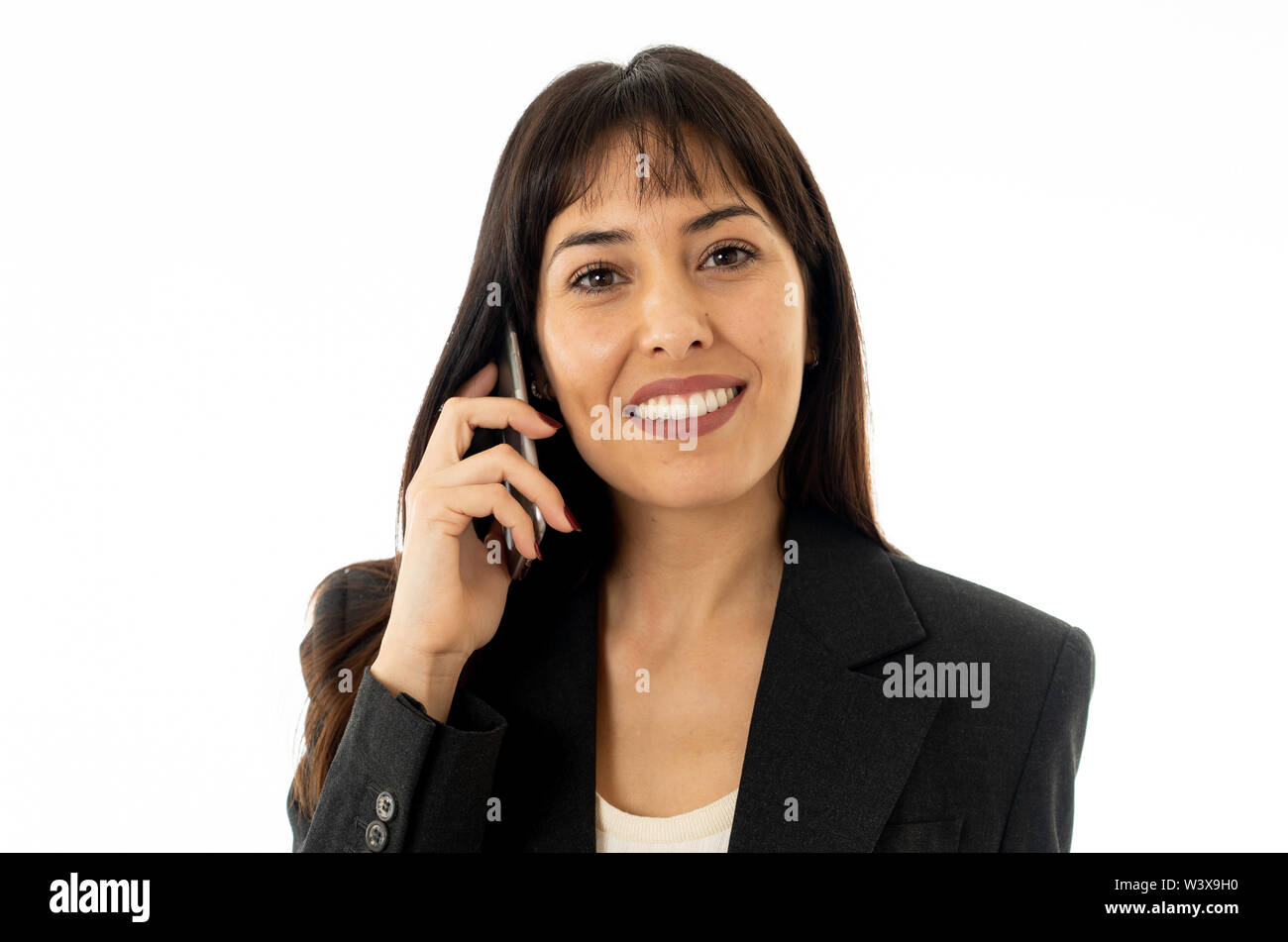 Close up of a young beautiful business woman standing speaking on the ...