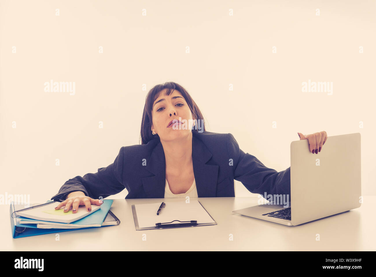 Young beautiful business woman suffering stress working at office ...