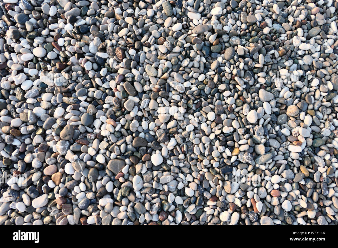 Grey pebble as a background Stock Photo - Alamy
