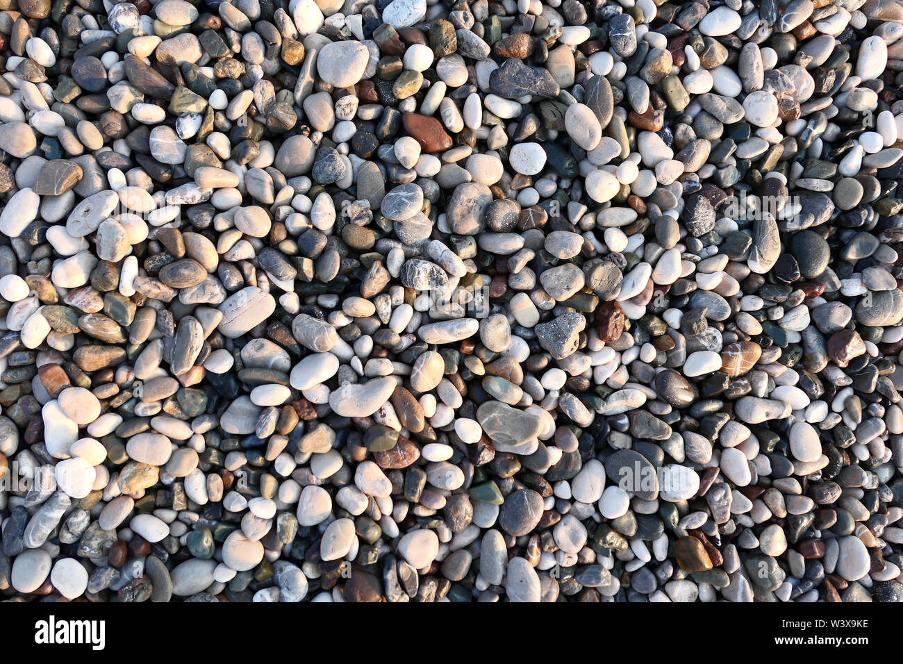Grey pebble as a background Stock Photo - Alamy