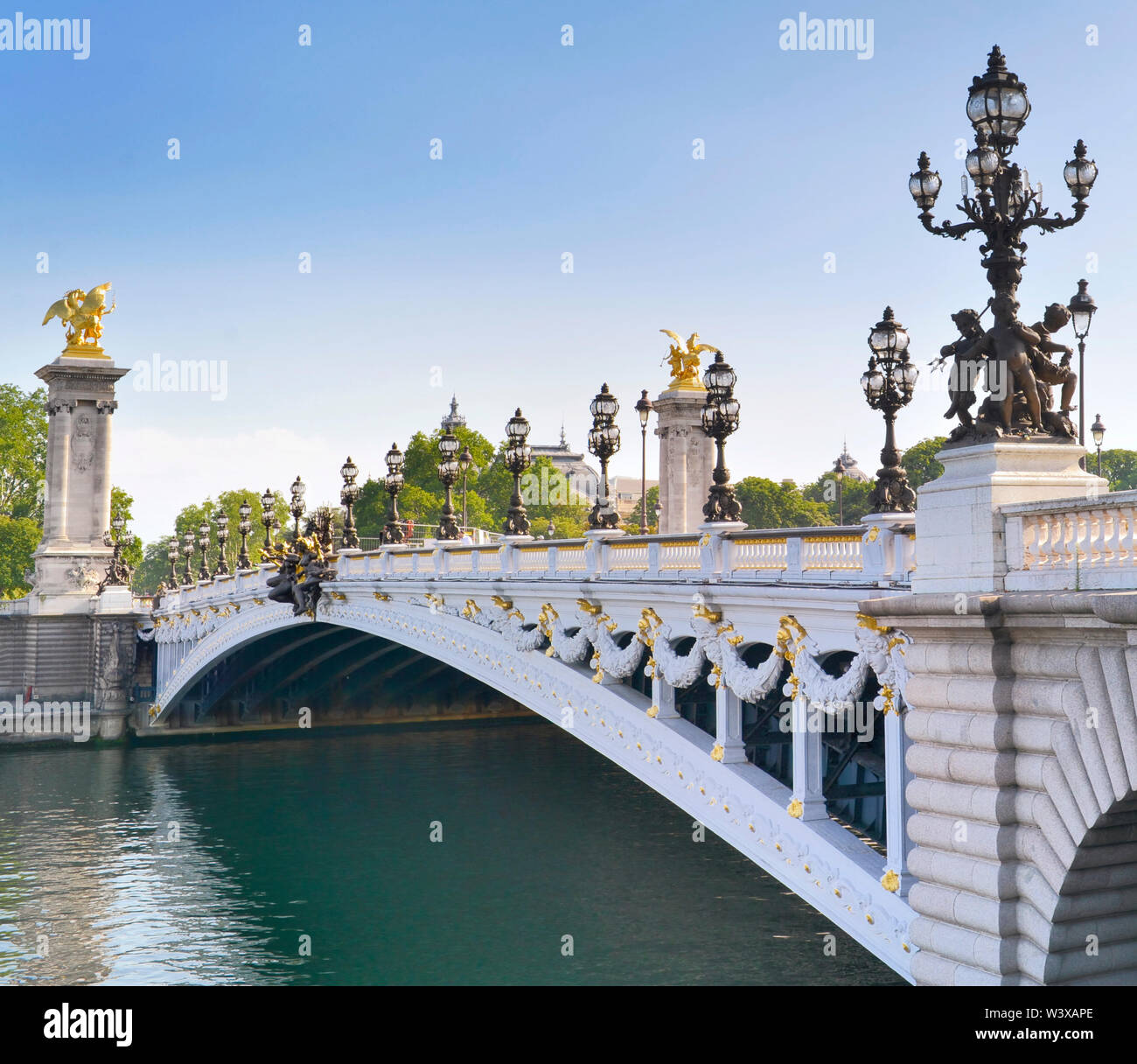famous and beautiful Alexander III bridge in Paris crossing the Seine ...