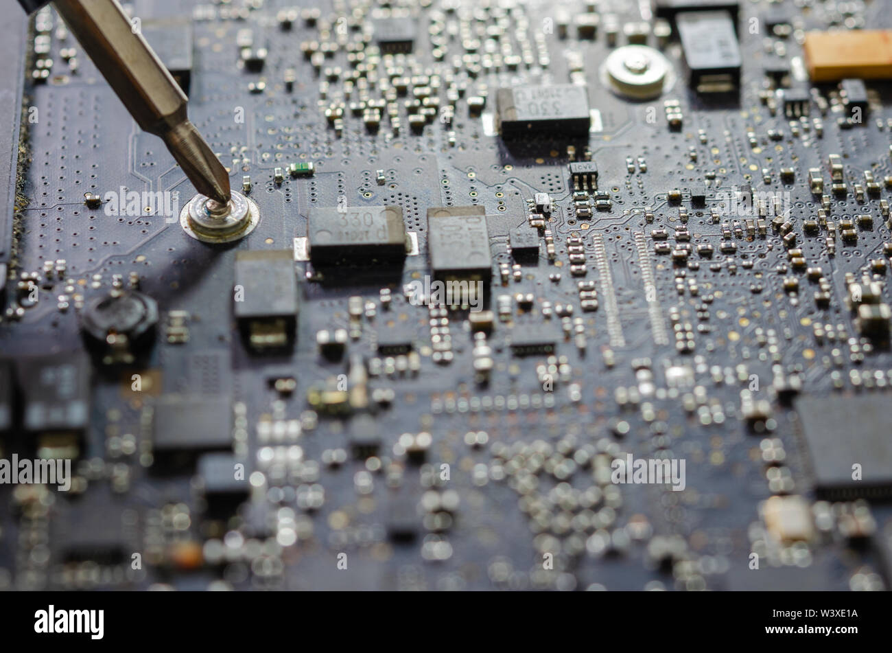 Screwdriver, notebook computer circuit board Stock Photo - Alamy