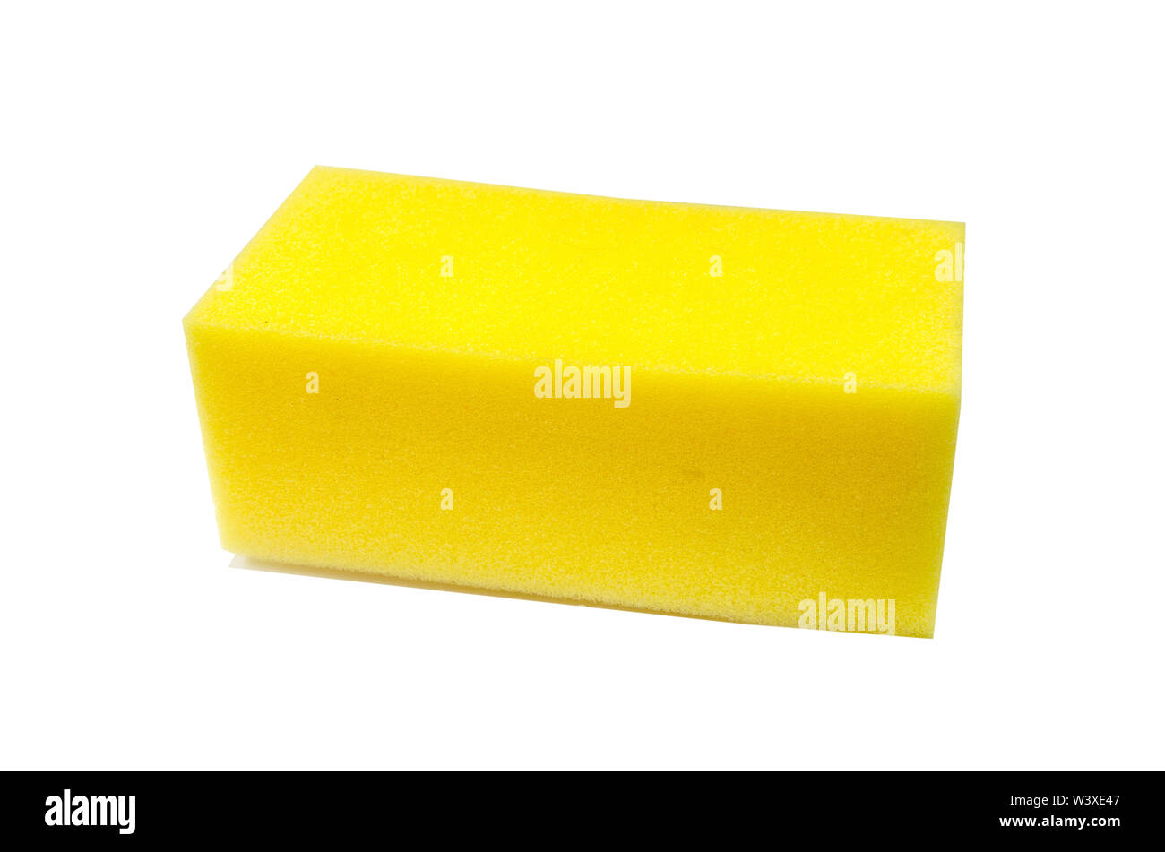 Yellow sponge on white background Stock Photo - Alamy