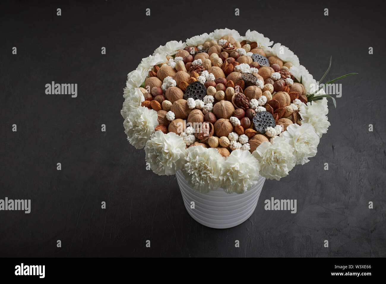 Unique bouquet made up of different types of nuts, decorated with ...