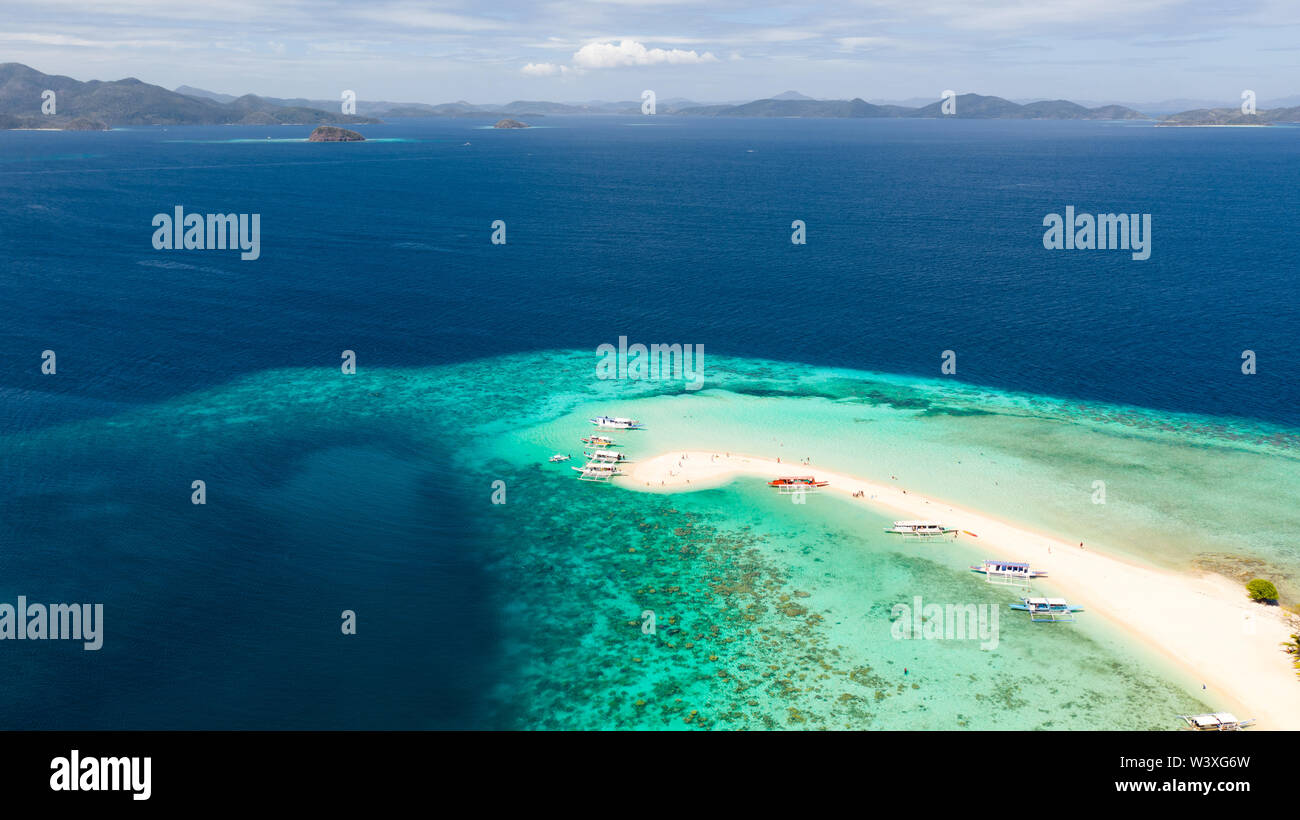 aerial seascape tropical island with sand bar, turquoise water and ...