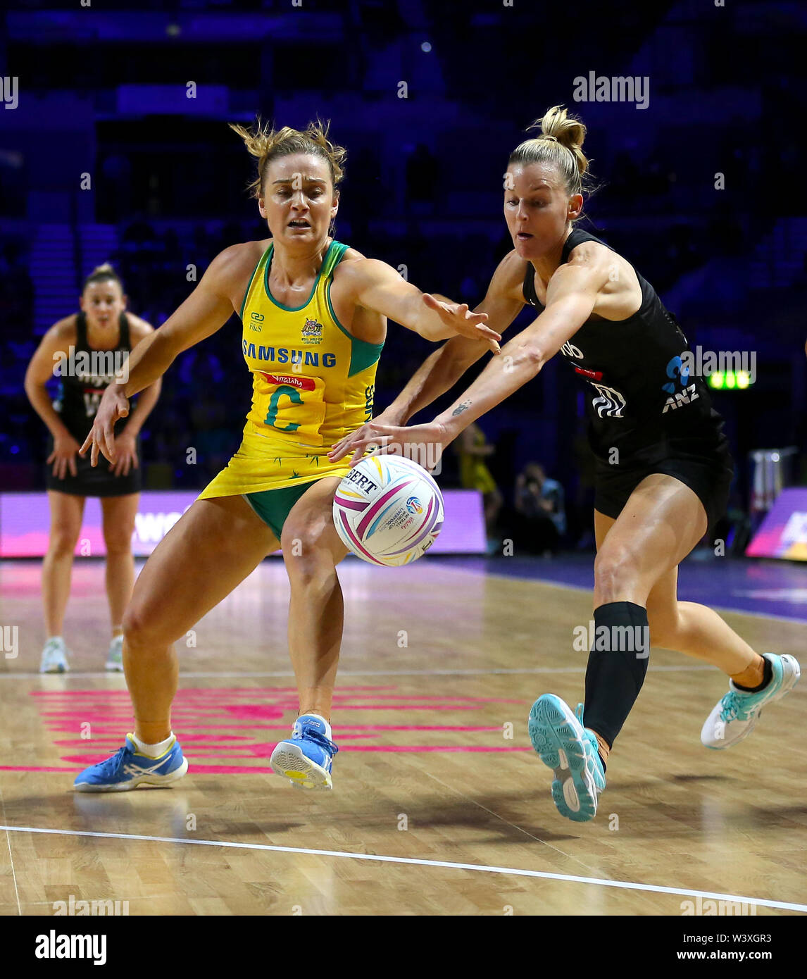 Australia's Liz Watson (left) and New Zealand's Katrina Rore battle for ...