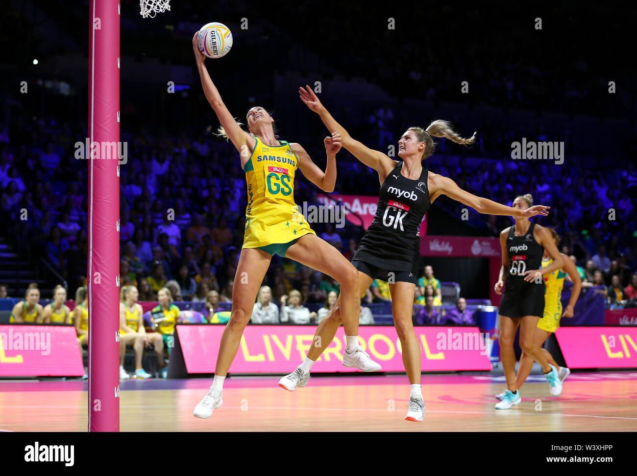 Australia's Caitlin Bassett (left) and New Zealand's Jane Watson battle ...