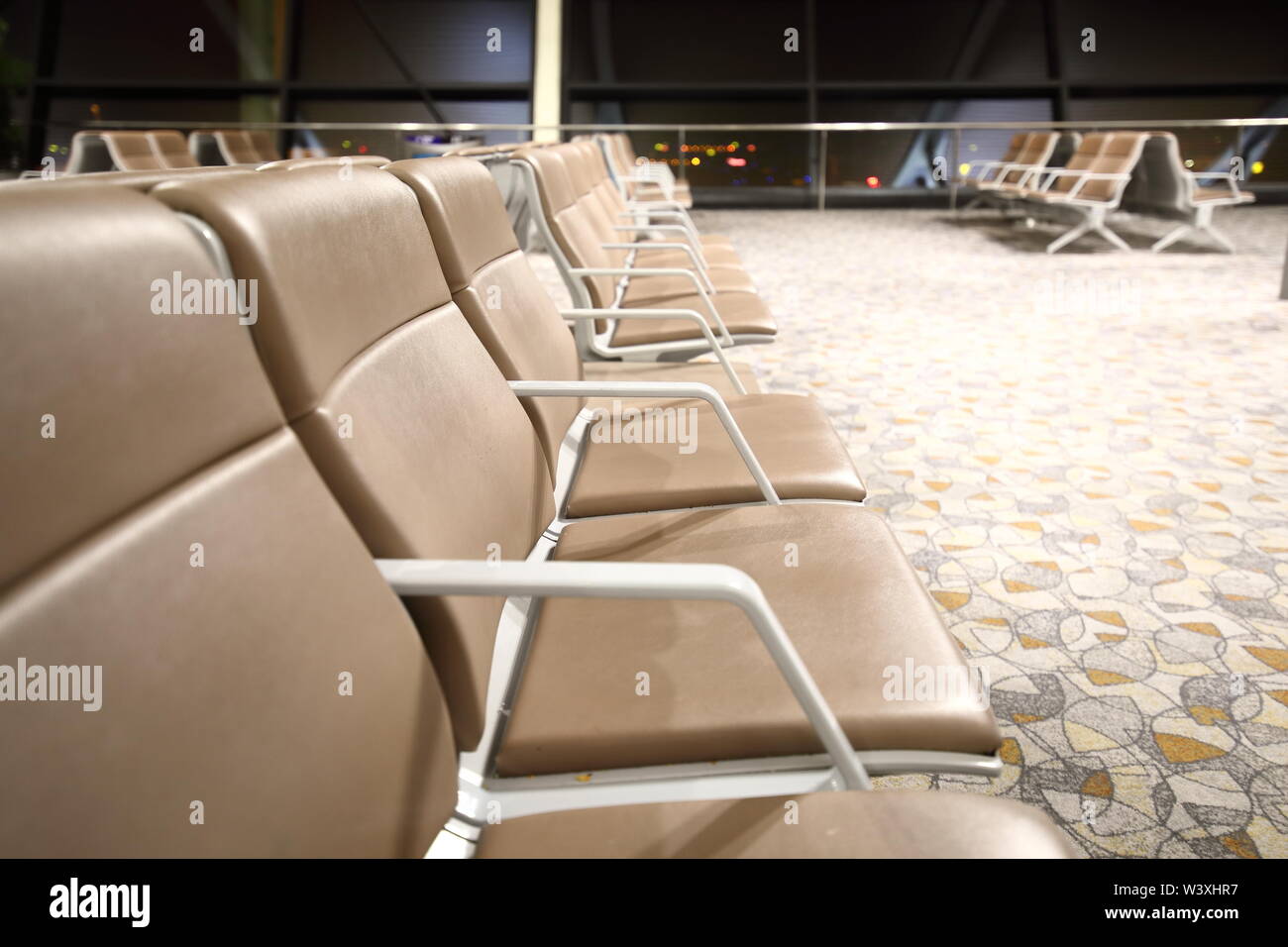 Airport chair bench interior background Stock Photo - Alamy