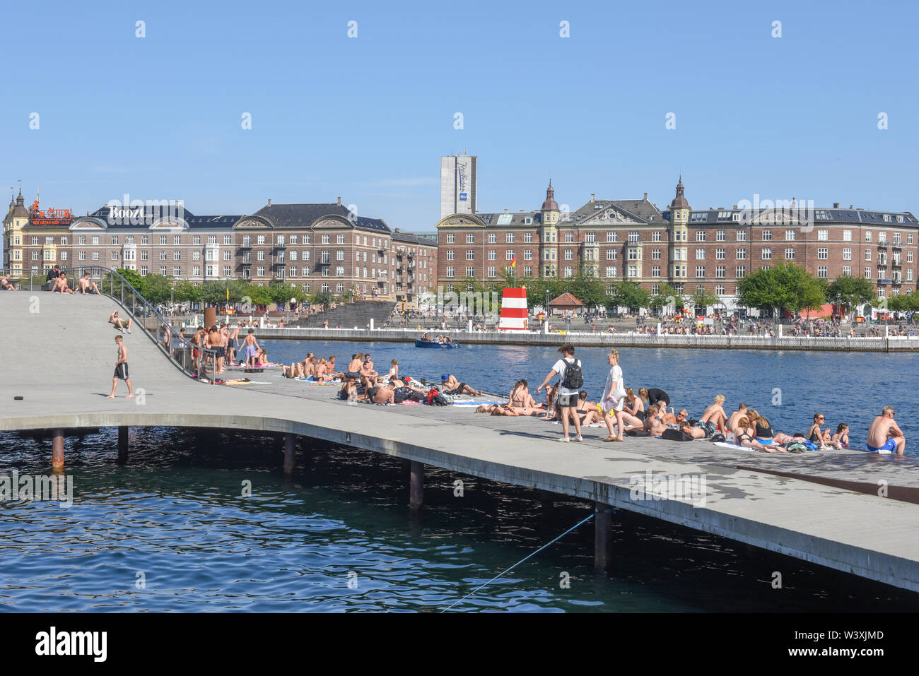 Copenhagen Denmark - 25 June 2019: people sunbathing in the center of ...