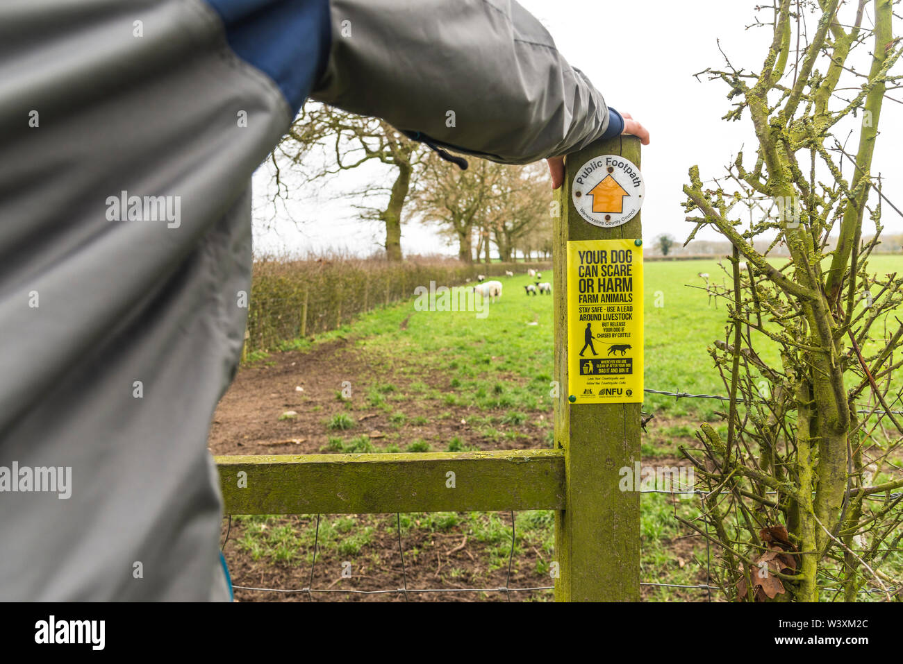 Public footpath signpost on farm UK Stock Photo - Alamy