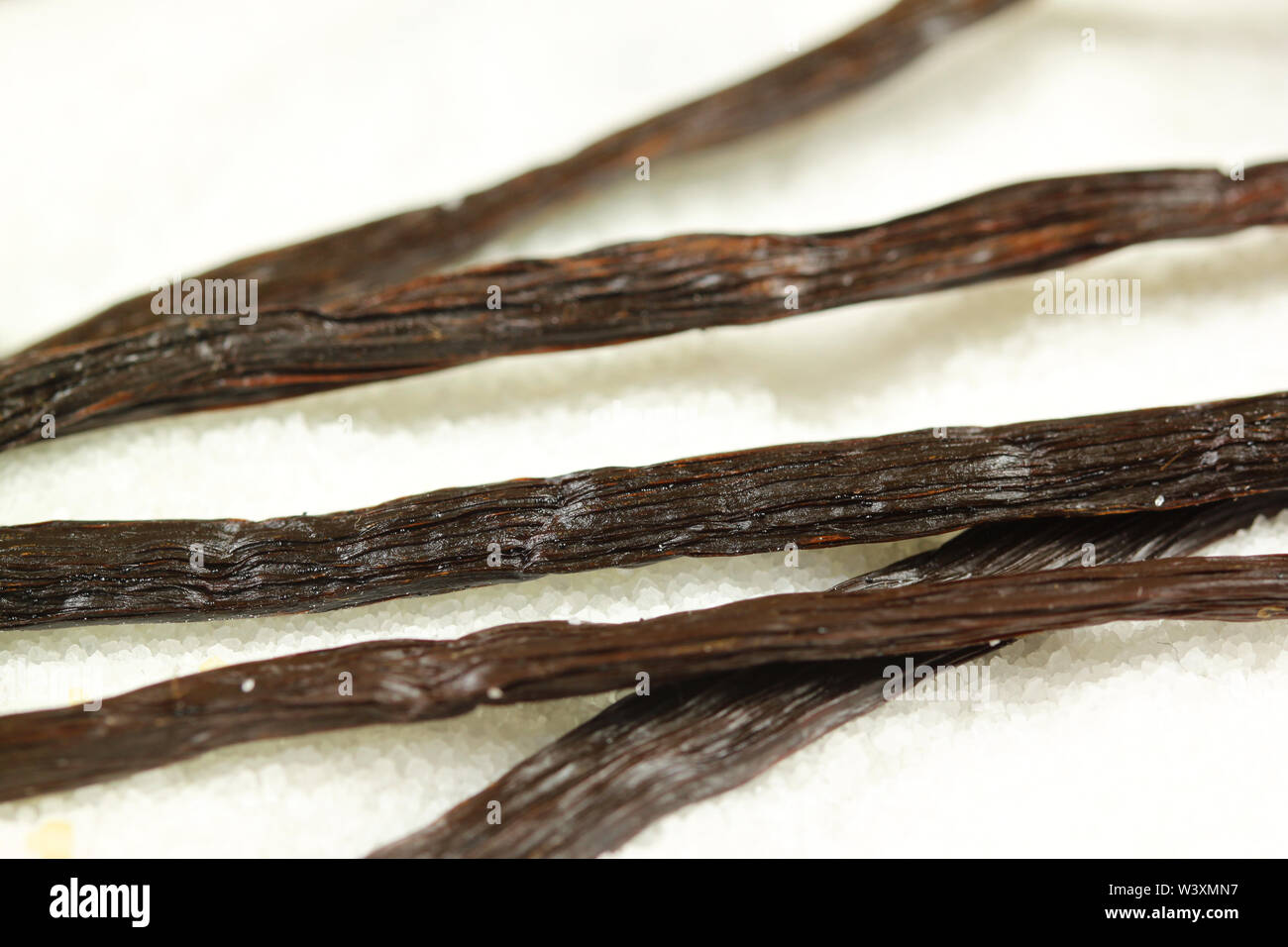 Vanilla sticks in white sugar crystals Stock Photo - Alamy