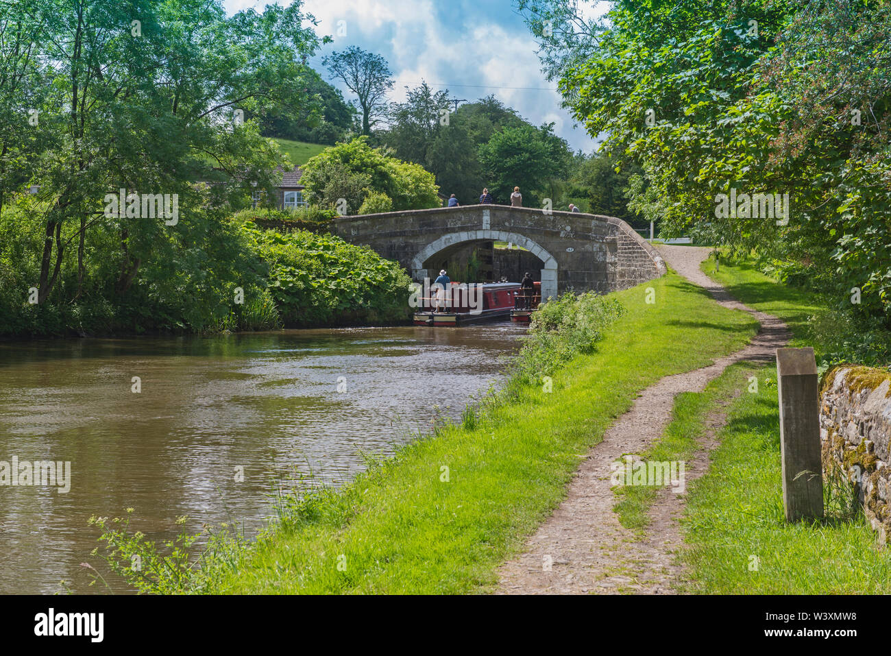 Narrowboat entering lock in English rural countryside scenery on ...