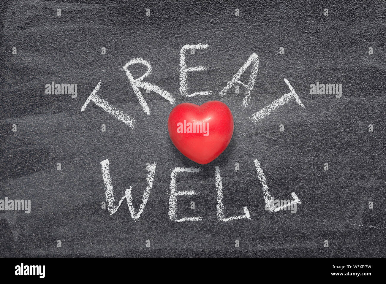 treat well phrase handwritten on chalkboard with red heart symbol ...
