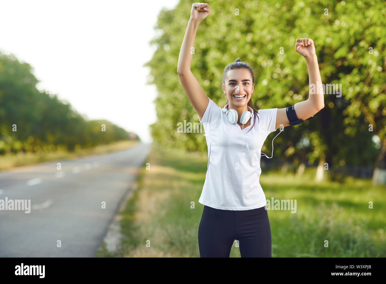 Hands up girl hi-res stock photography and images - Alamy