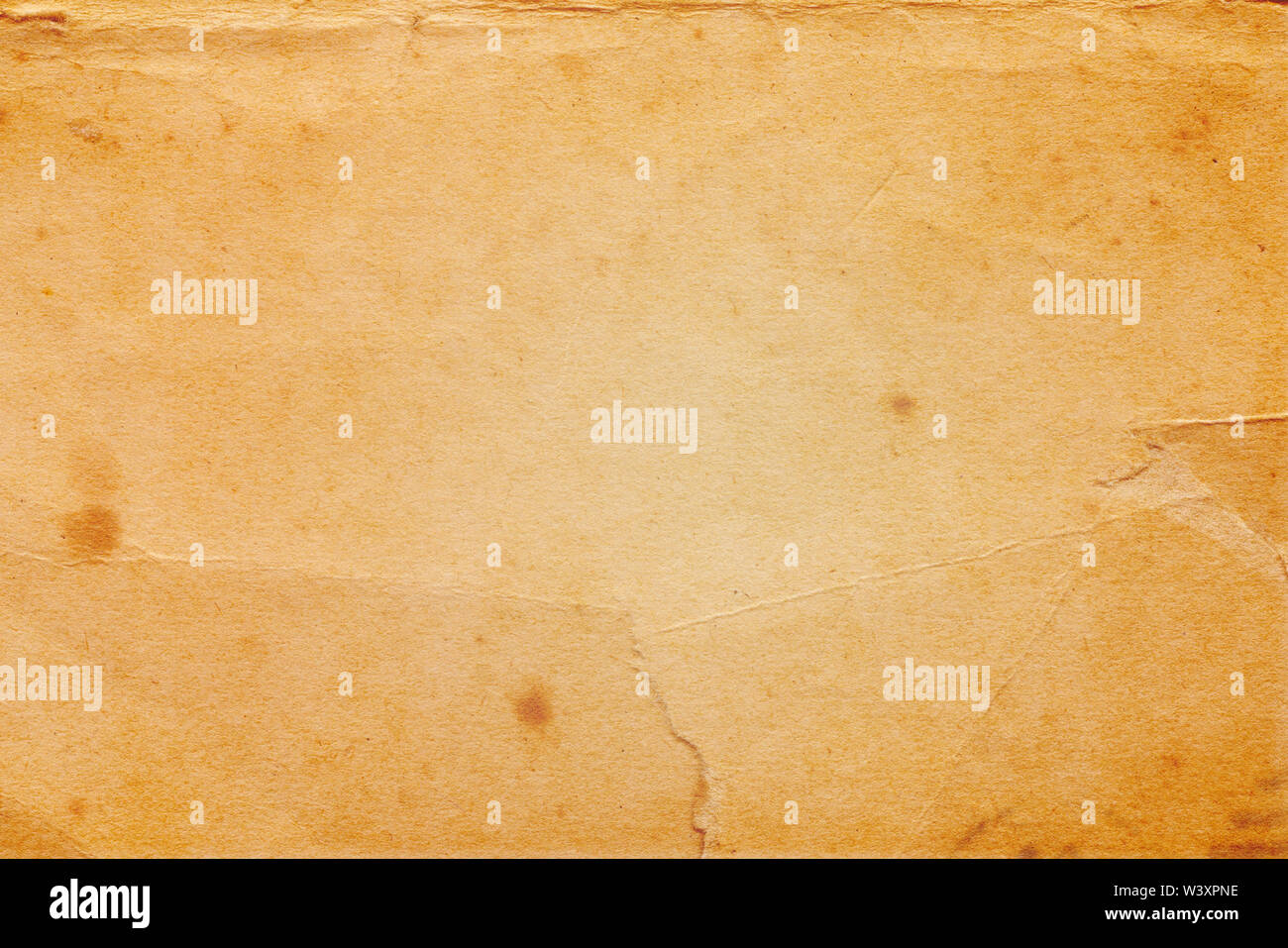 detailed yellowish vintage paper texture with many dents and scratches ...