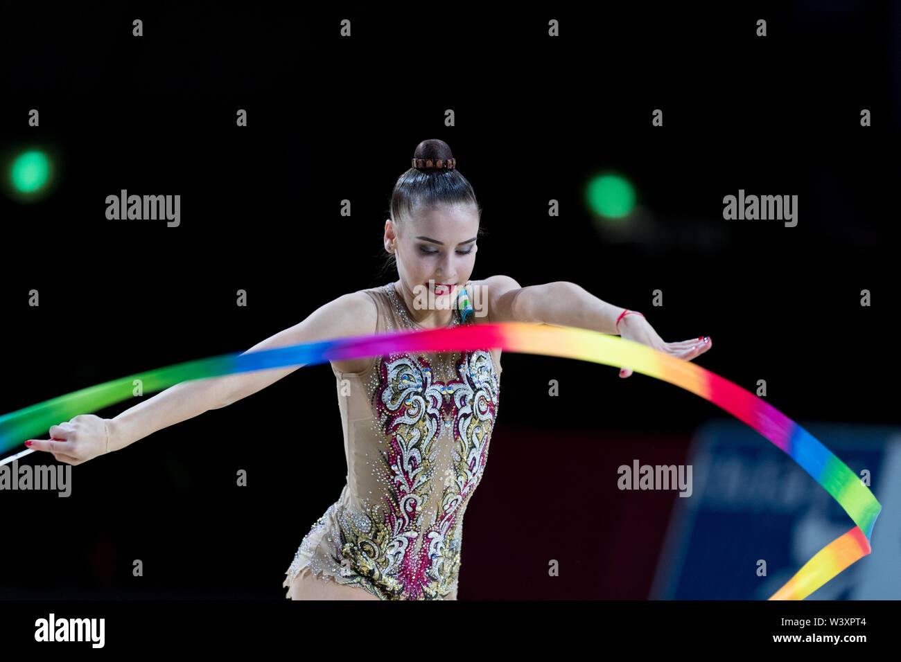 Sabrina Tashkenbaeva from Uzbekistan performs her ribbon routine during ...