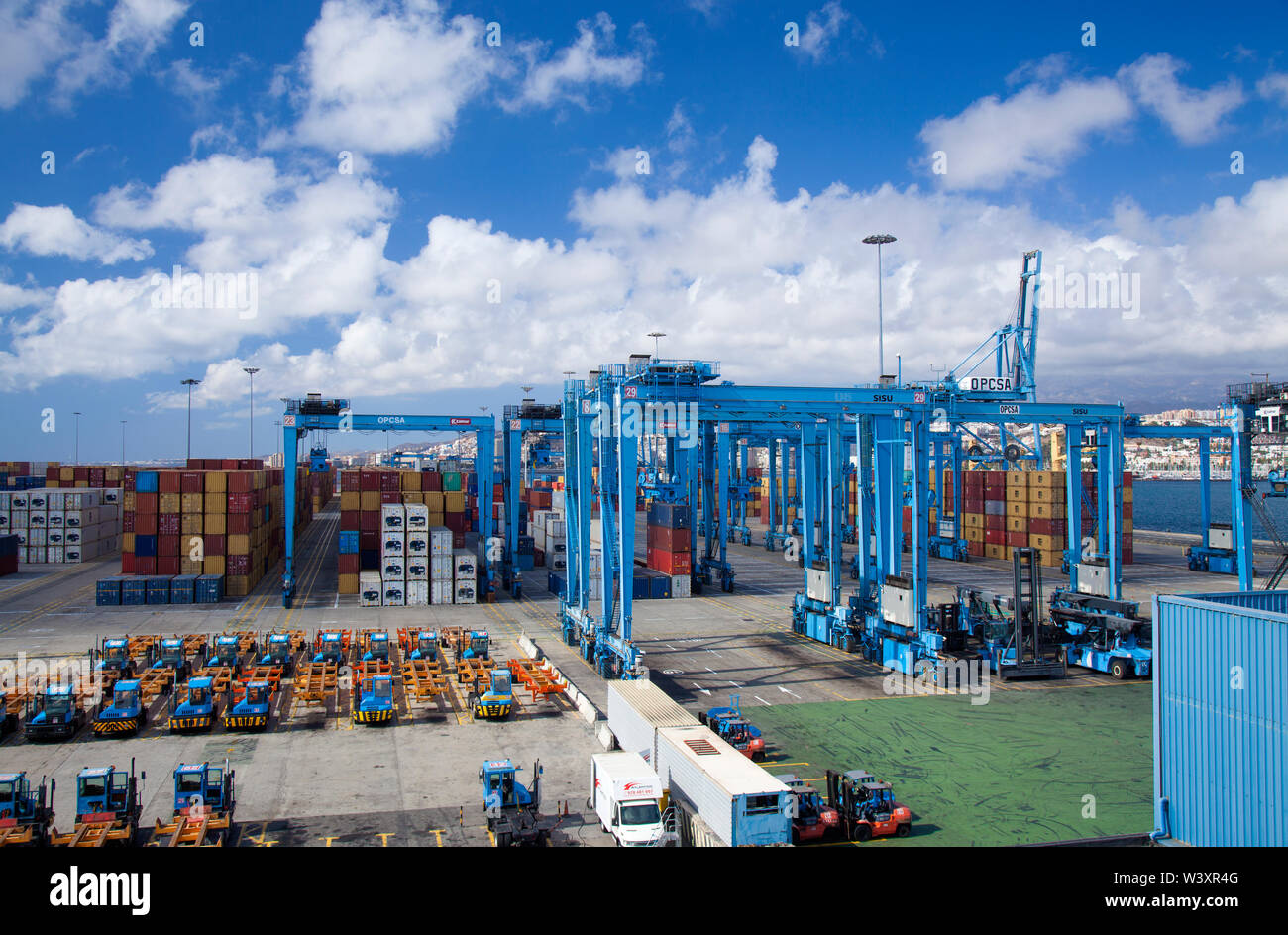 LAS PALMAS, SPAIN - July 11: Cargo containers are handled in busy cargo ...