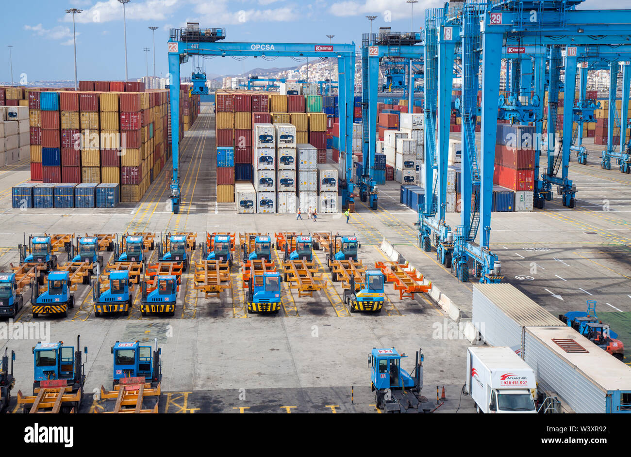 LAS PALMAS, SPAIN - July 11: Cargo containers are handled in busy cargo ...