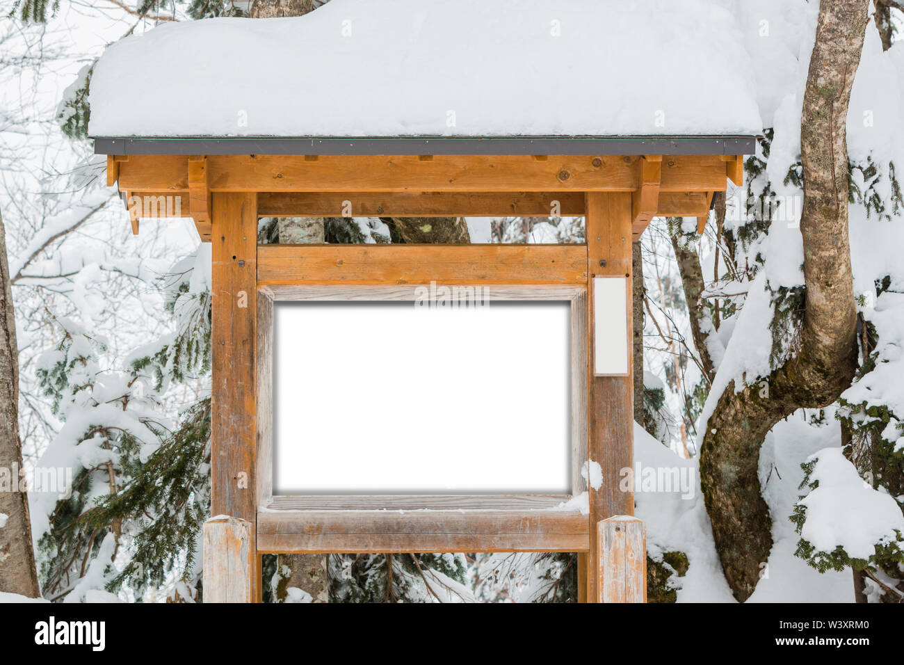 Wooden sign board, covered snow in winter concept Stock Photo - Alamy