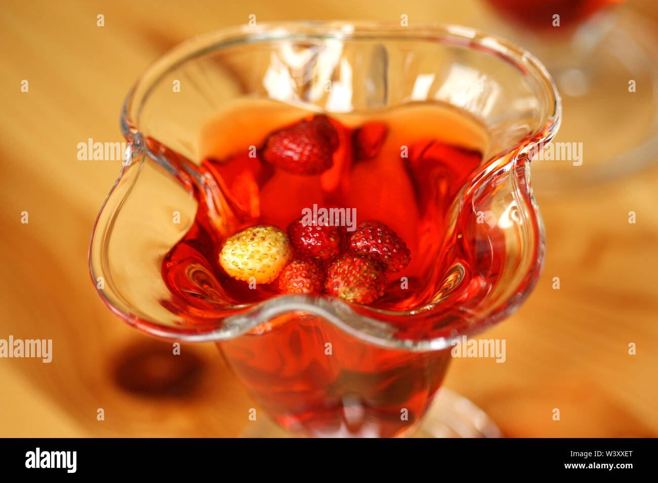 Red gelatin with wild strawberry fruits Stock Photo - Alamy