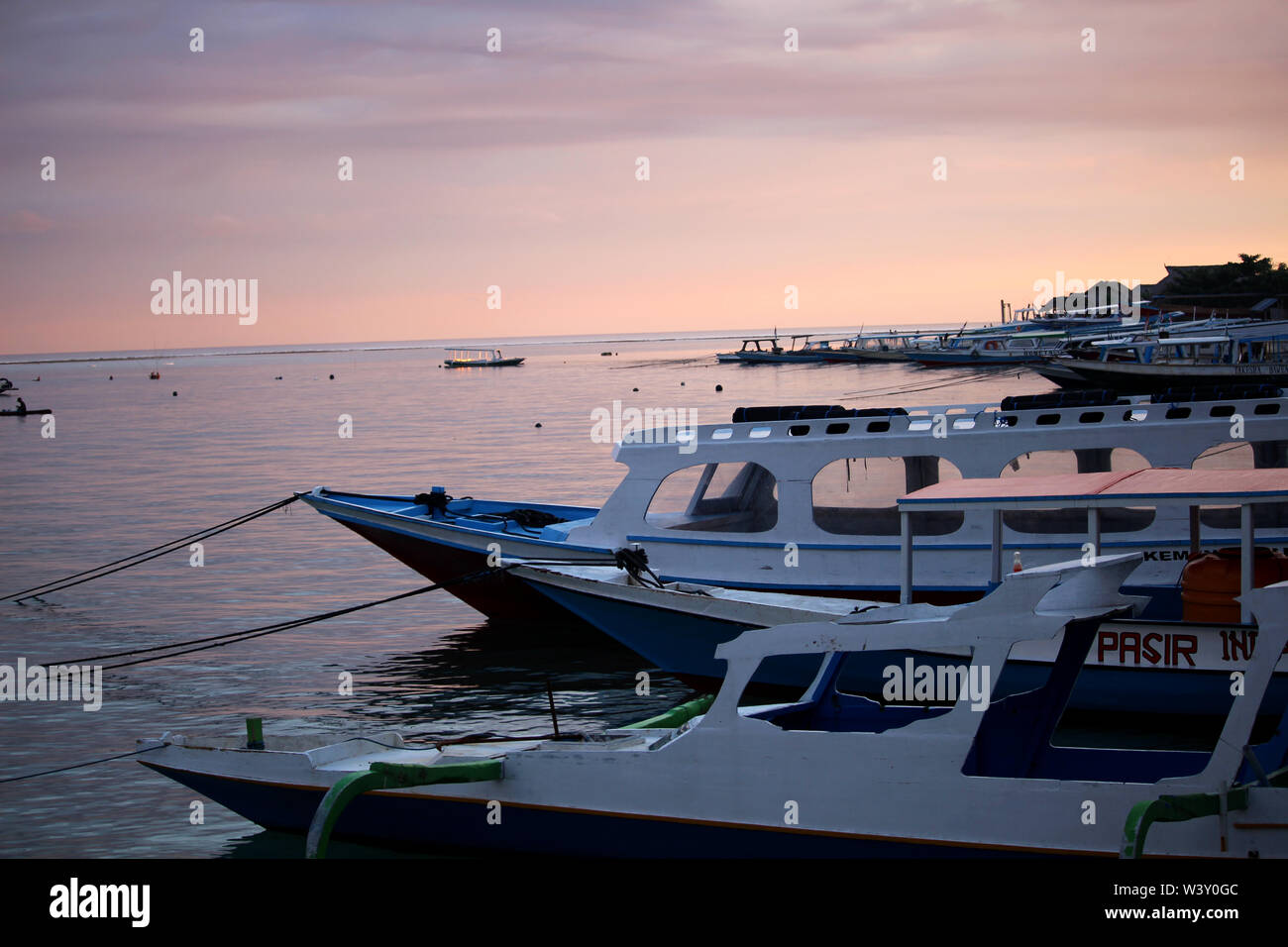Boats in Bali at sunset, Indonesia Stock Photo - Alamy