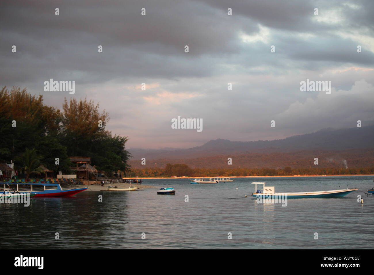 Boats in Bali at sunset, Indonesia Stock Photo - Alamy