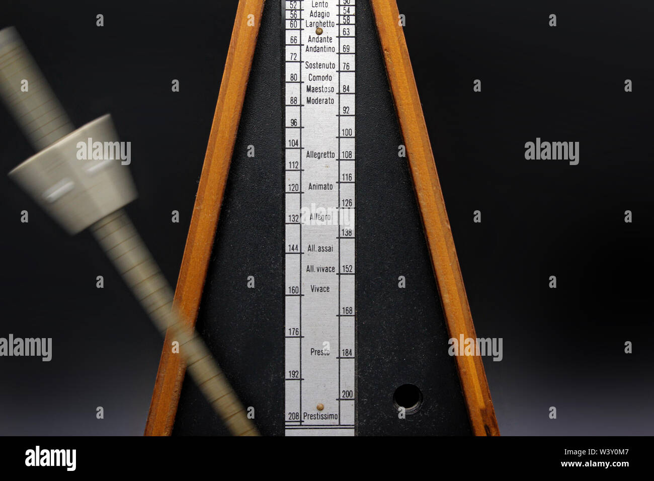 Vintage metronome close-up isolated on a black background Stock Photo ...