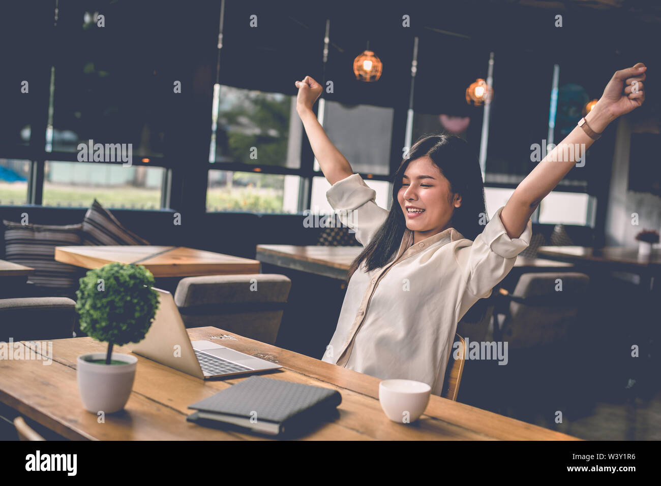 Business people raising hands hi-res stock photography and images - Alamy