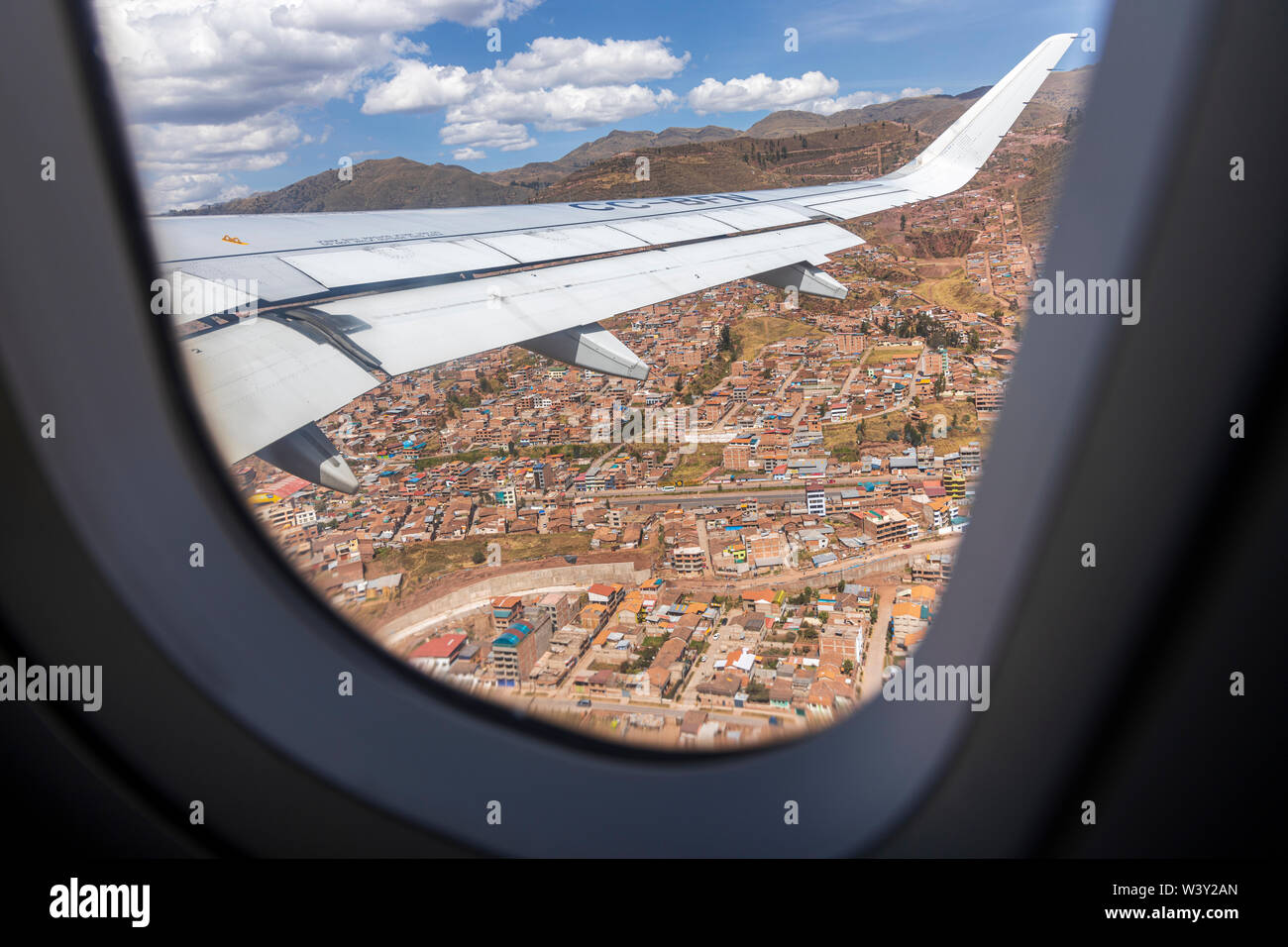 Aerial view over Cusco from inside a passenger plane, Peru, South ...