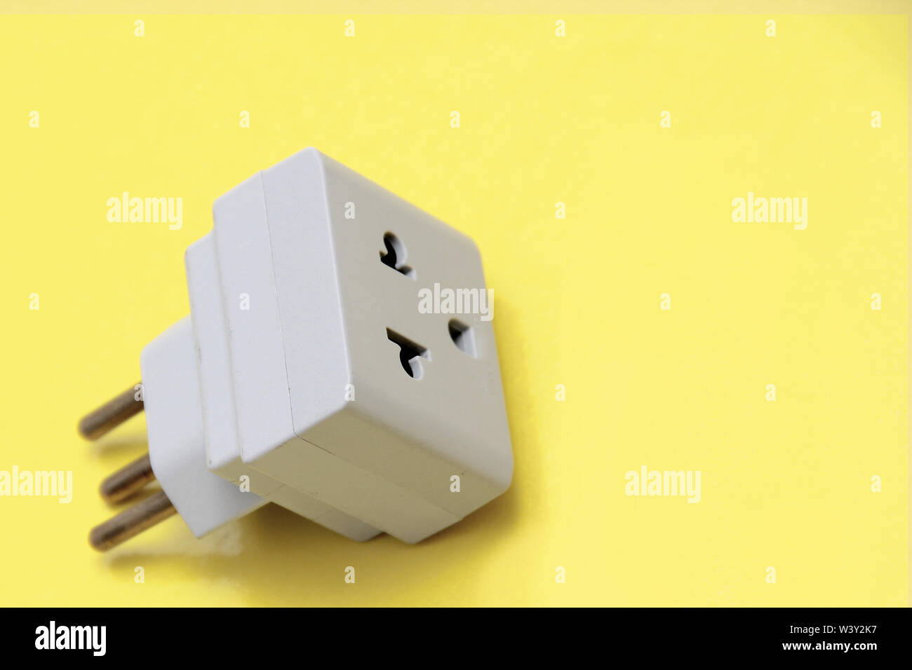 Brazilian socket adapter on yellow background Stock Photo - Alamy