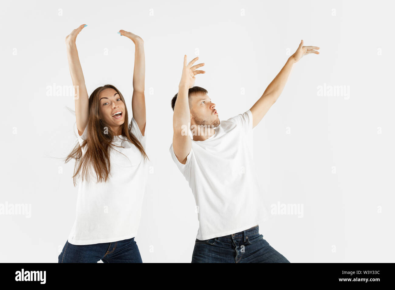Beautiful young couple's portrait isolated on white studio background ...