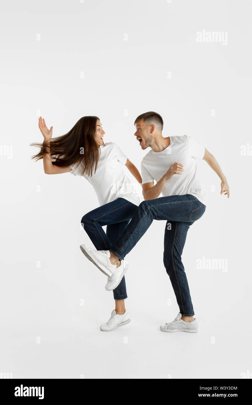 Beautiful young couple's portrait isolated on white studio background ...