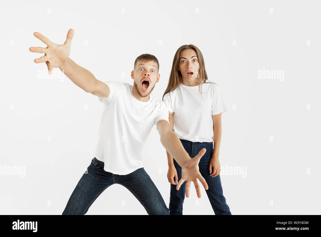 Beautiful young couple's portrait isolated on white studio background ...