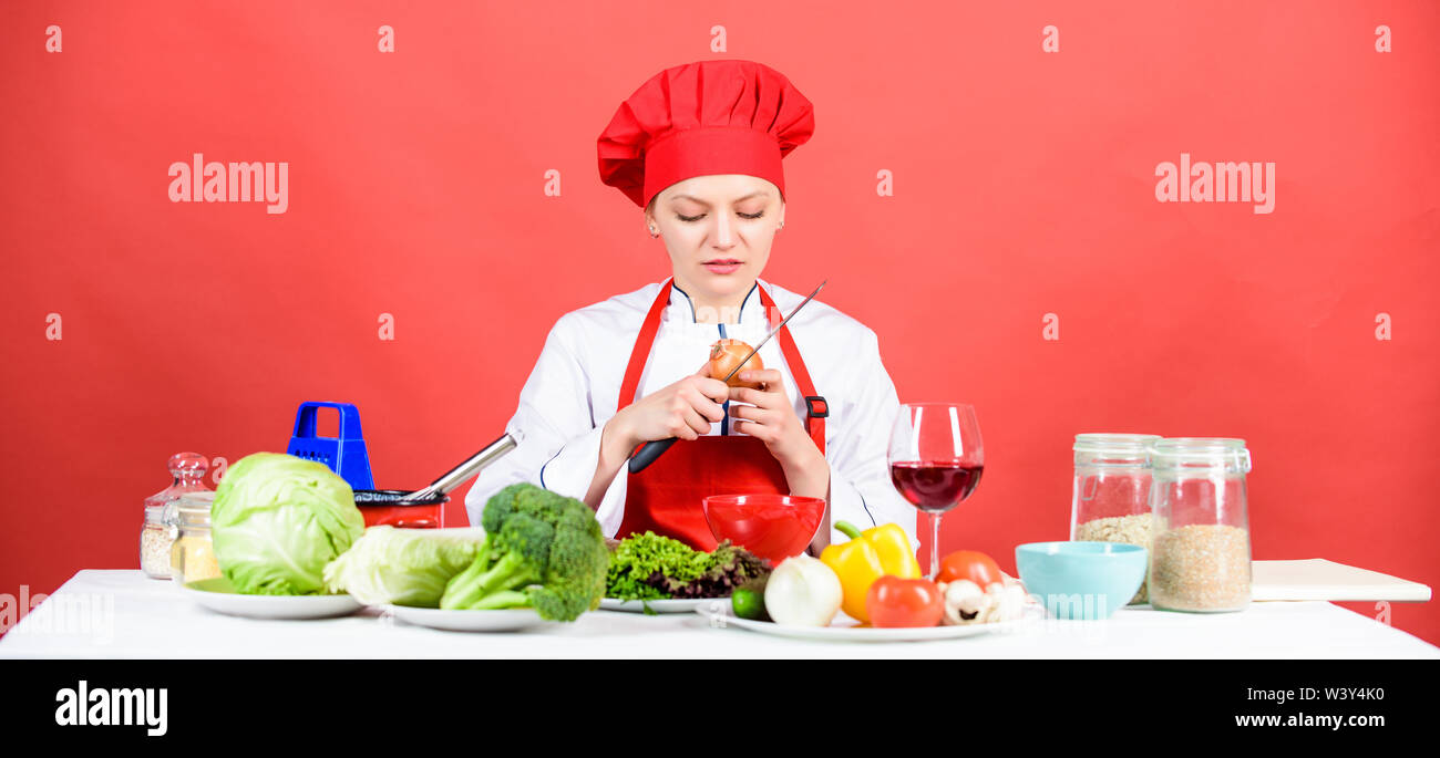 Housewife cook crying while cutting onion. Slice and chop onion ...