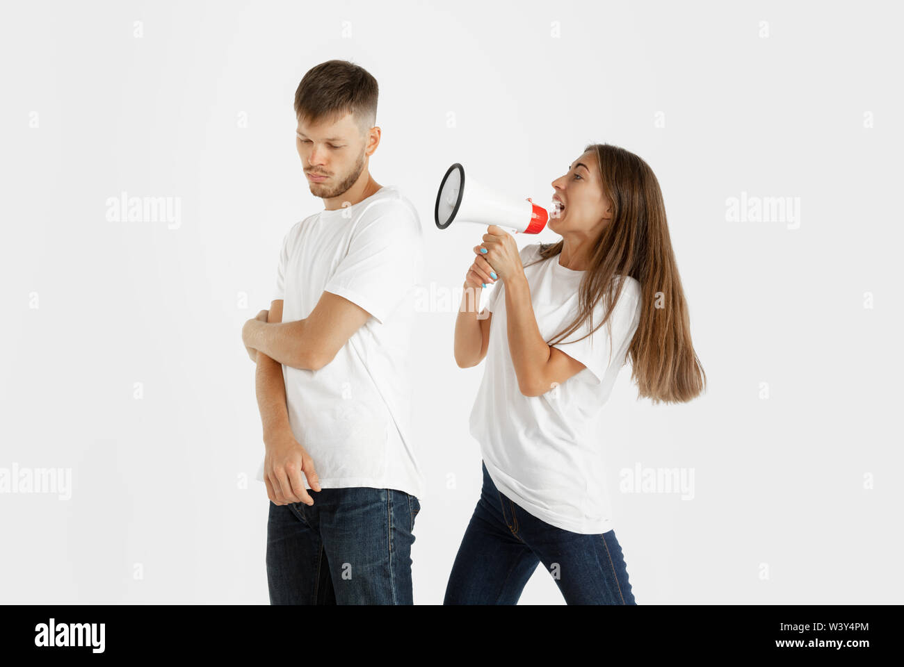 Beautiful young couple's portrait isolated on white studio background ...
