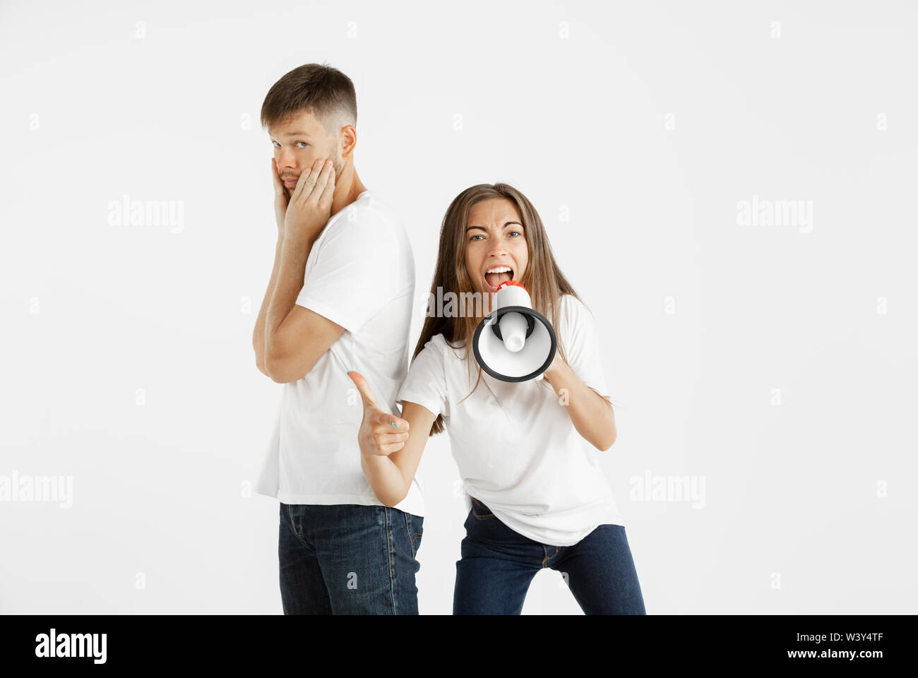 Beautiful young couple's portrait isolated on white studio background ...