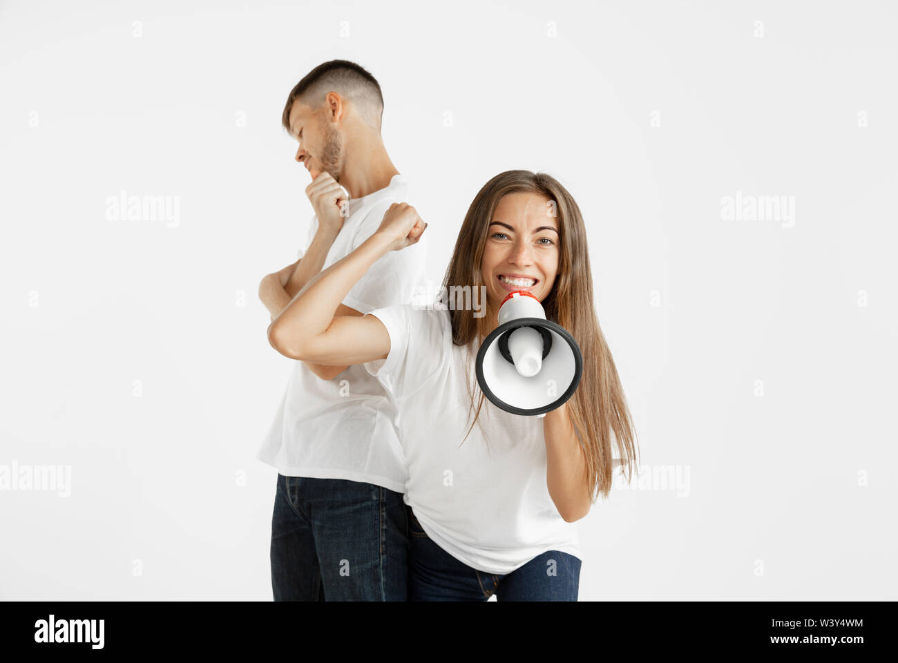 Beautiful young couple's portrait isolated on white studio background ...
