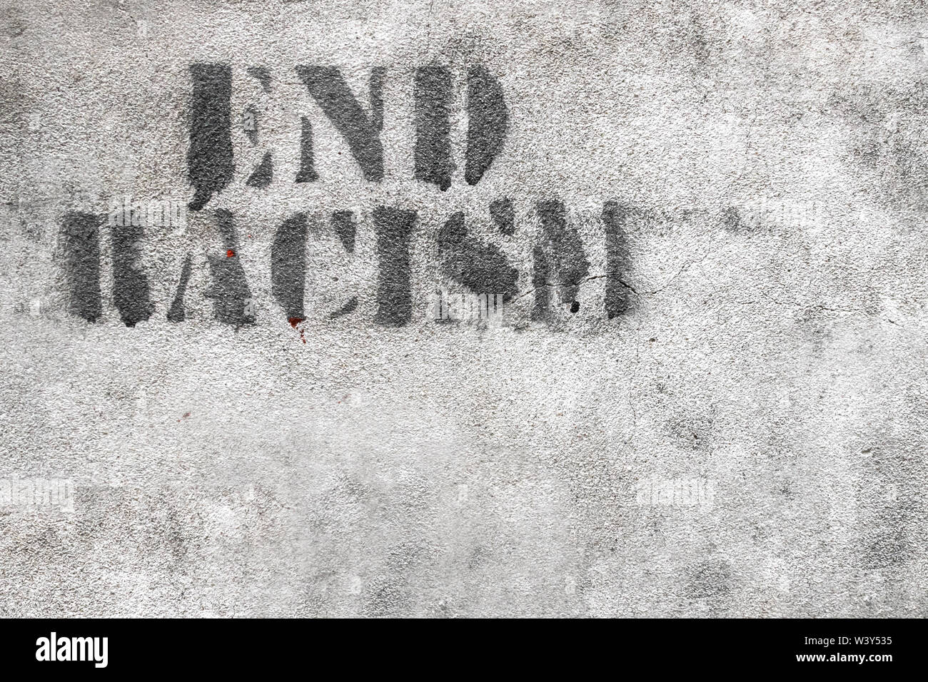 Graffiti on brick wall say - END RACISM. Ideal for concepts and ...