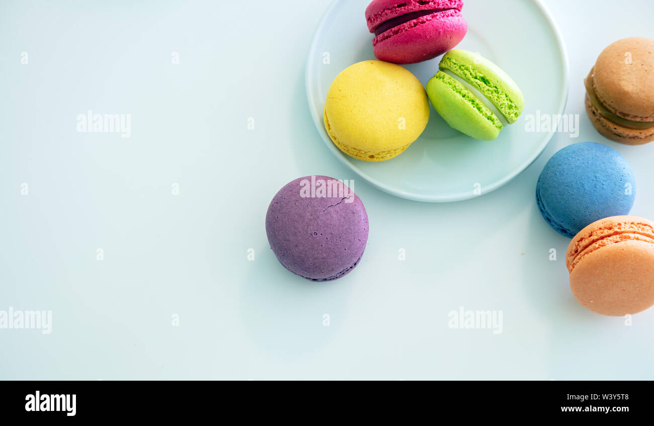 Macarons pastel colors with chocolate cream on white background, top ...