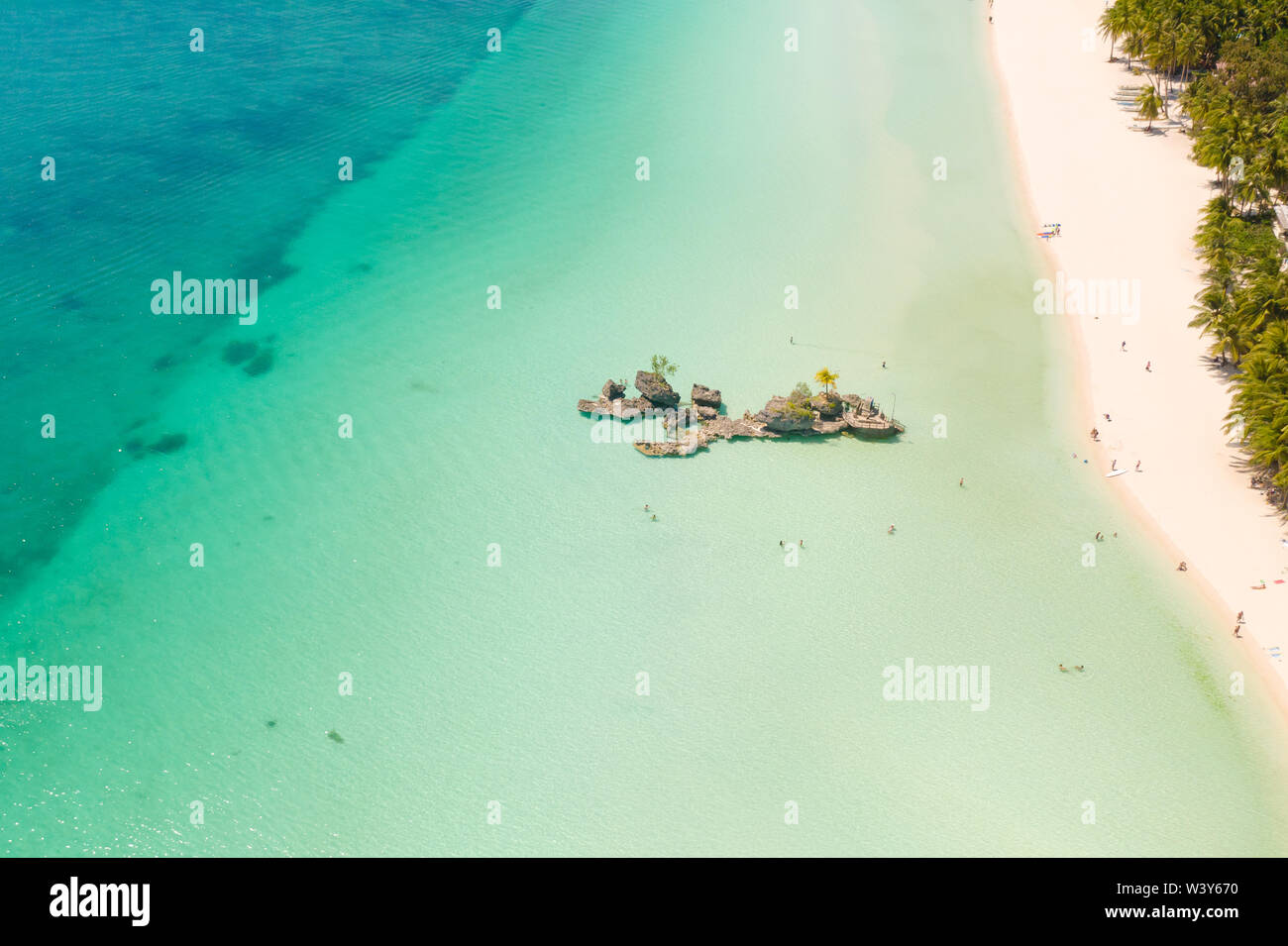White sand beach and lagoon with turquoise water, aerial view. Coast of ...